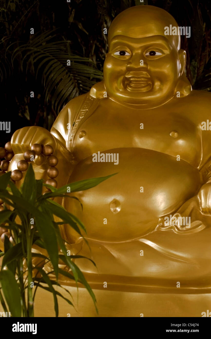A large gold statue is on display at a Buddhist temple in Northern ...