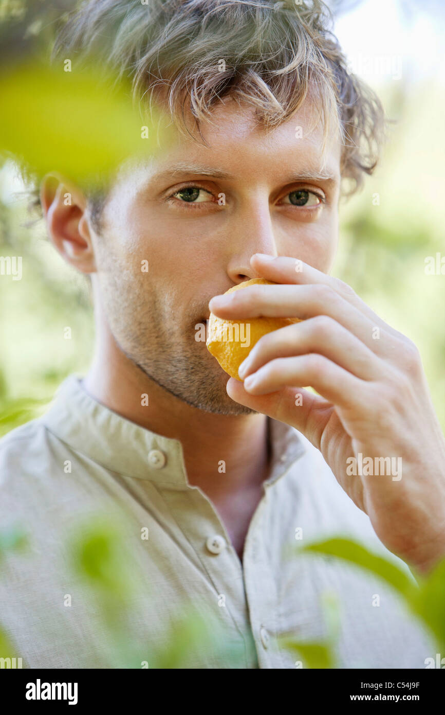 Young man smelling lemon hi-res stock photography and images - Alamy