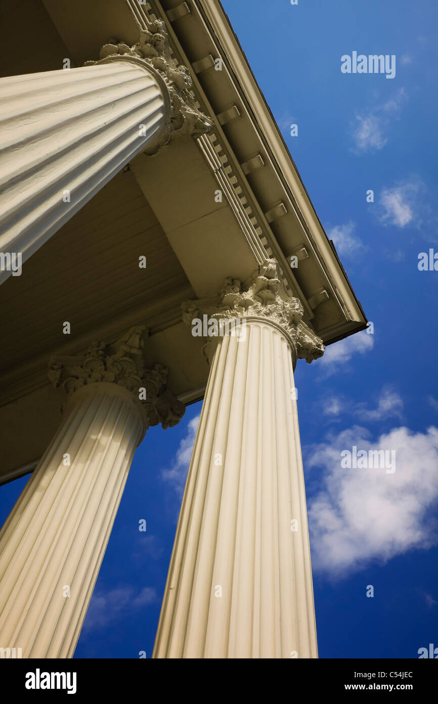 Three Corinthian columns in perspective against blue sky Stock Photo ...