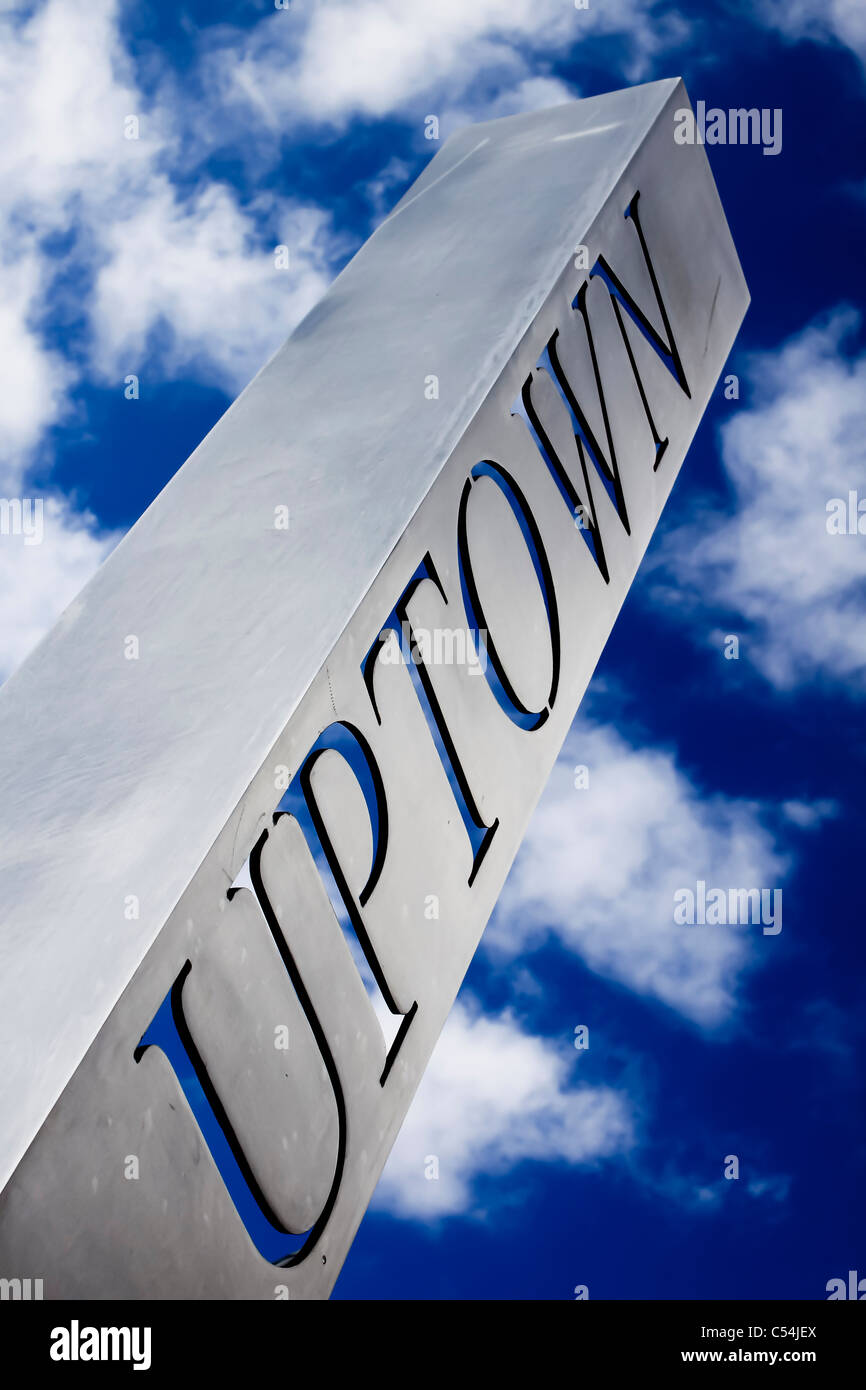 Sign made from stainless steel with the word uptown perforated in upper ...