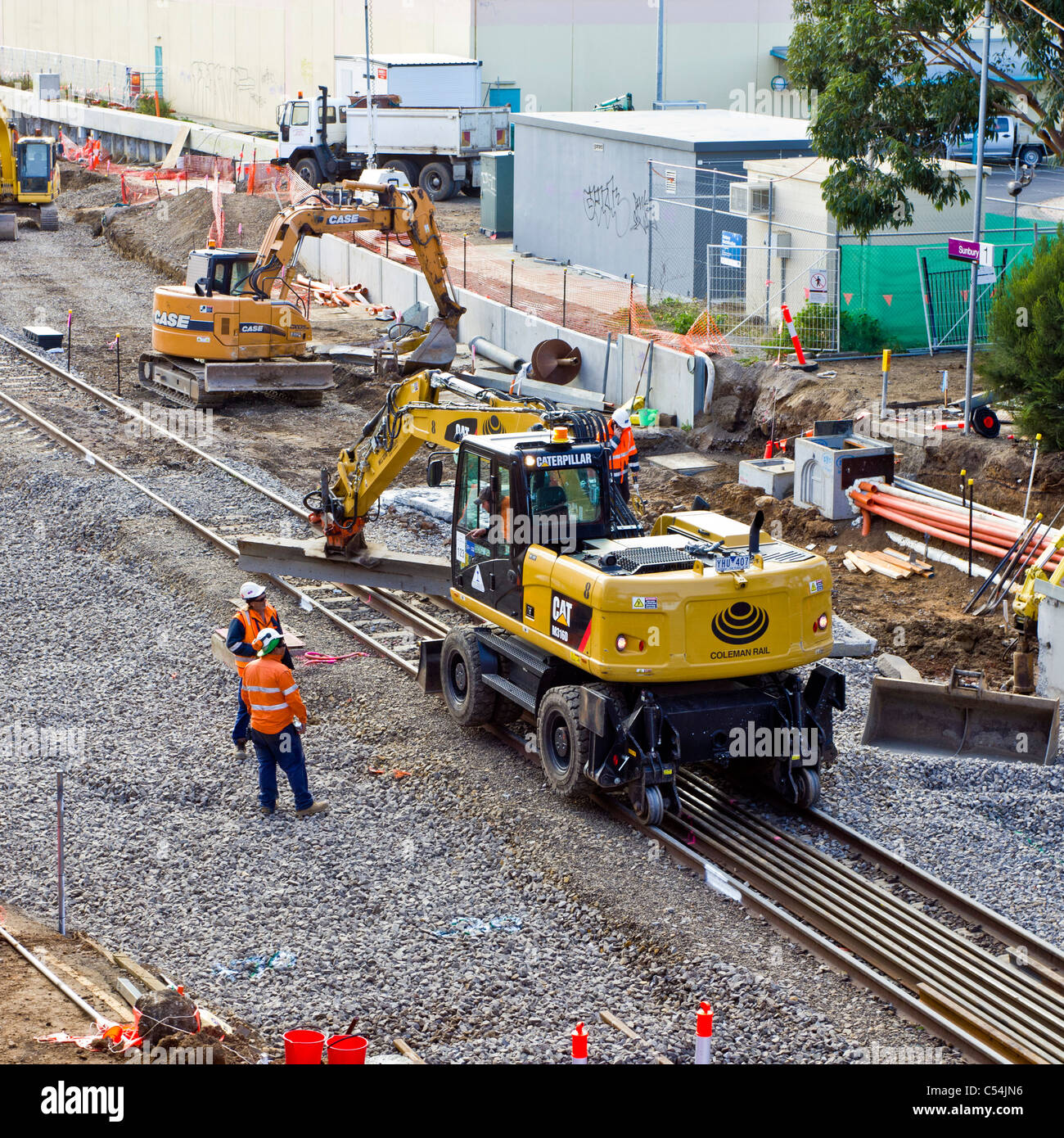 Engineers discussing progress on railway upgrade Stock Photo - Alamy