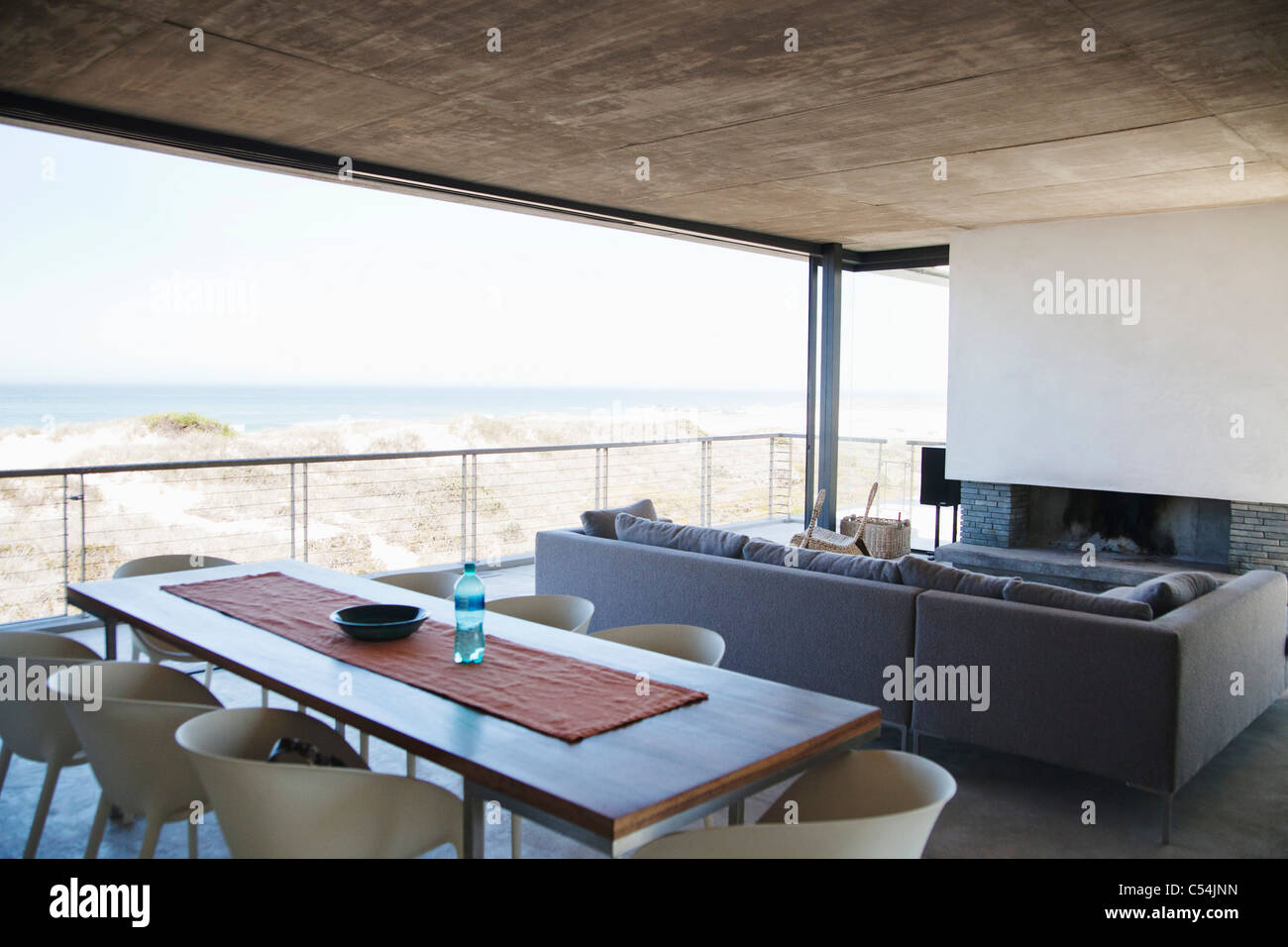 Home interiors with beach in the background Stock Photo - Alamy
