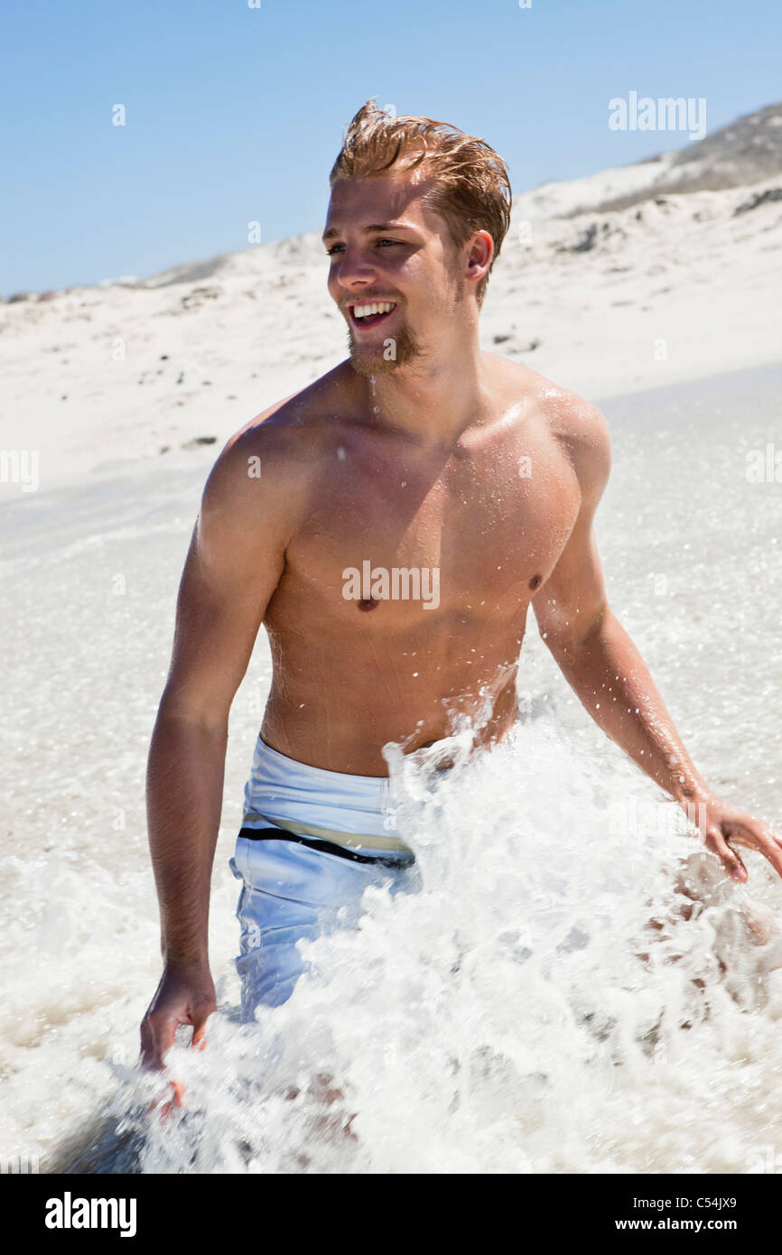 Man enjoying on a beach Stock Photo - Alamy