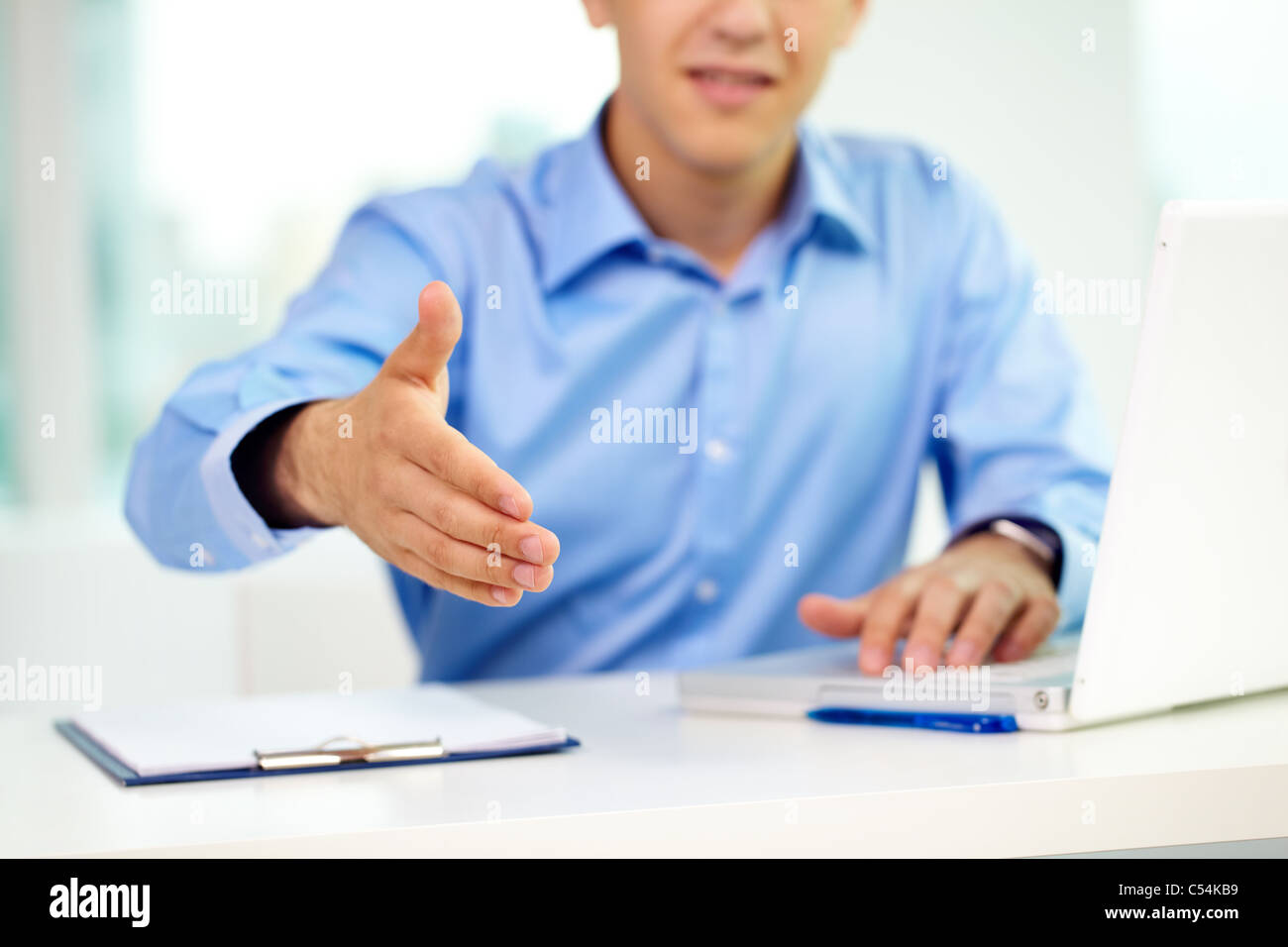 Image of successful businessman giving a hand for handshake Stock Photo ...