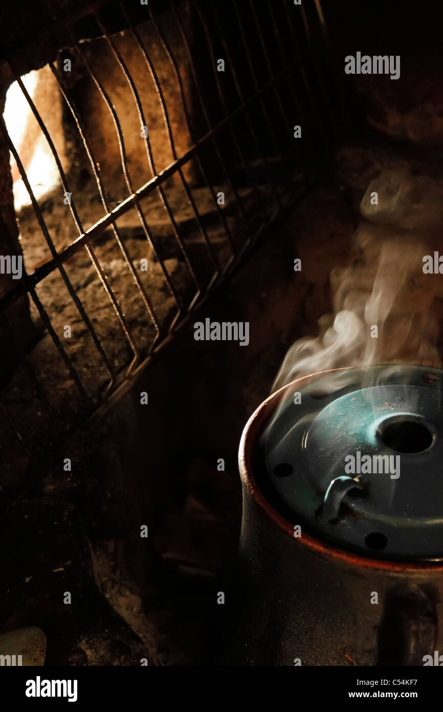 Light shining thru small window of wooden oven with boiling pot Stock ...