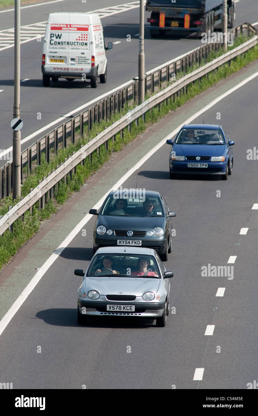 Cars travelling at speed too close to each other in the outside lane of ...