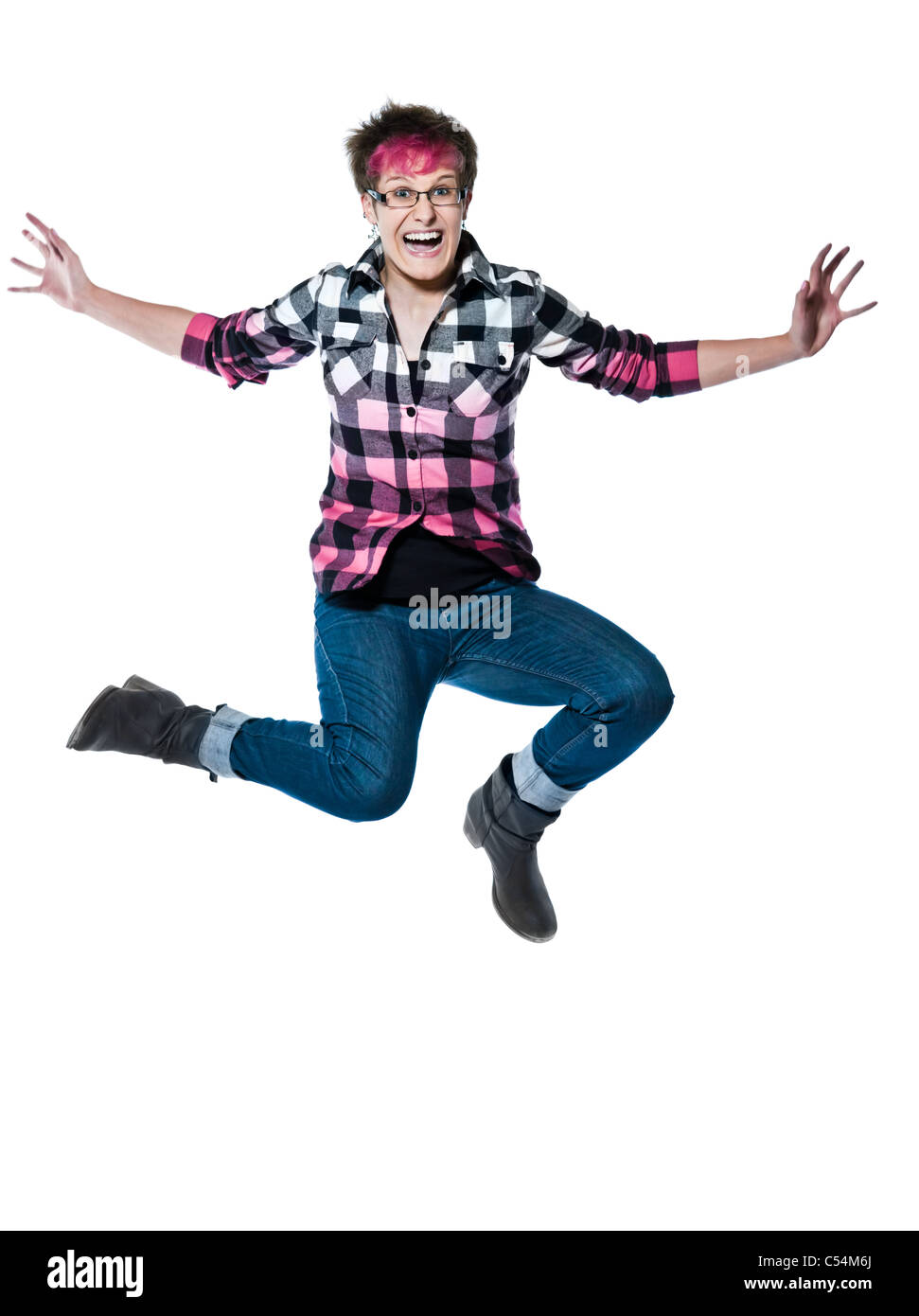 Full length of a funky casual young woman jumping in joy isolated over ...