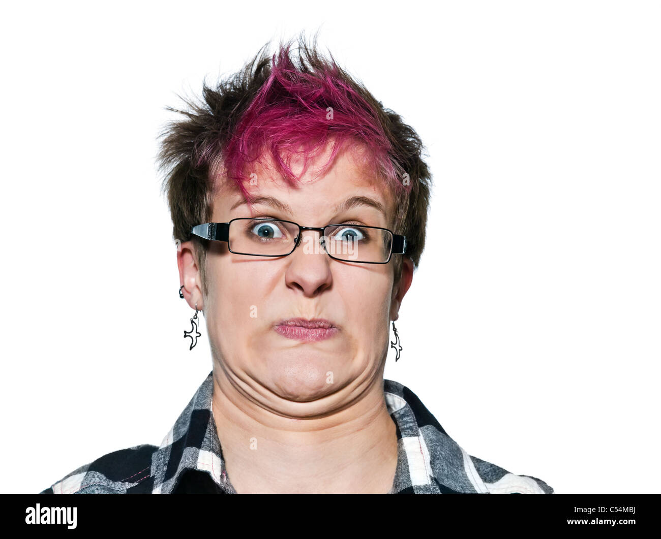 Close-up portrait of frustrated young expressive woman in studio on ...