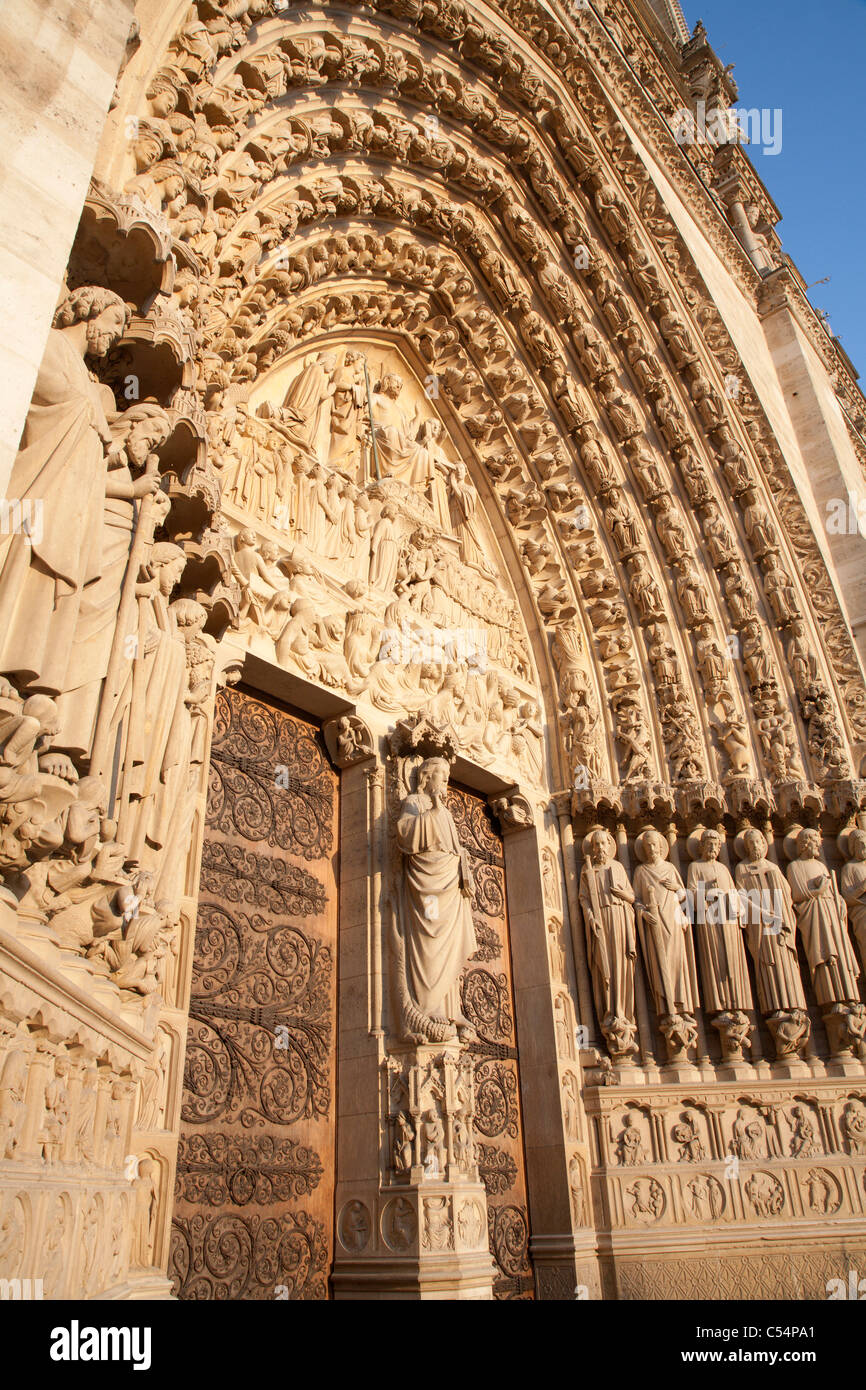 Paris - main portal of Notre-Dame cathedral in the sunset light Stock ...
