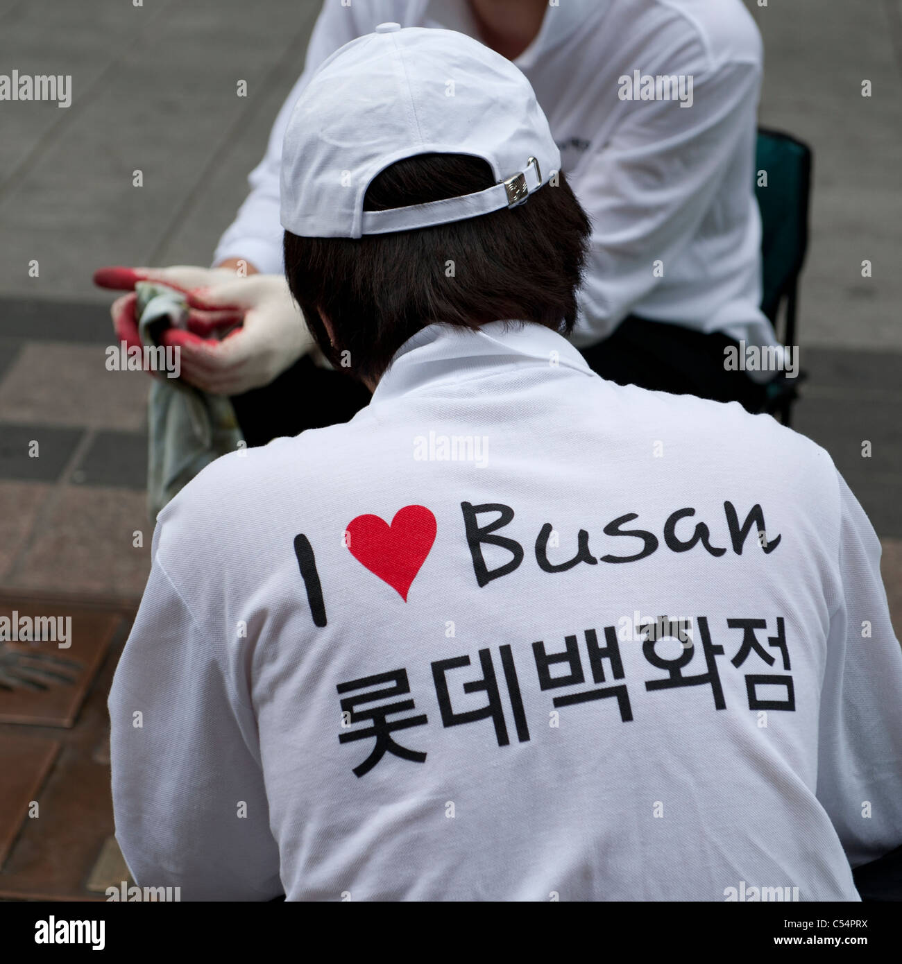 Rear view of wearing t shirt of love busan logo hi-res stock ...