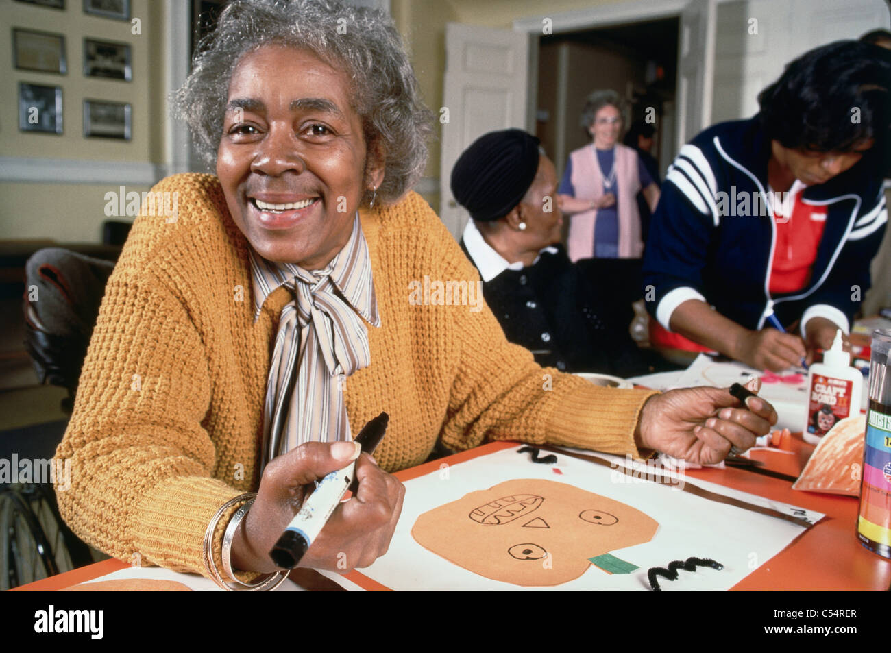 Portrait of smiling senior woman in senior citizens center Stock Photo ...