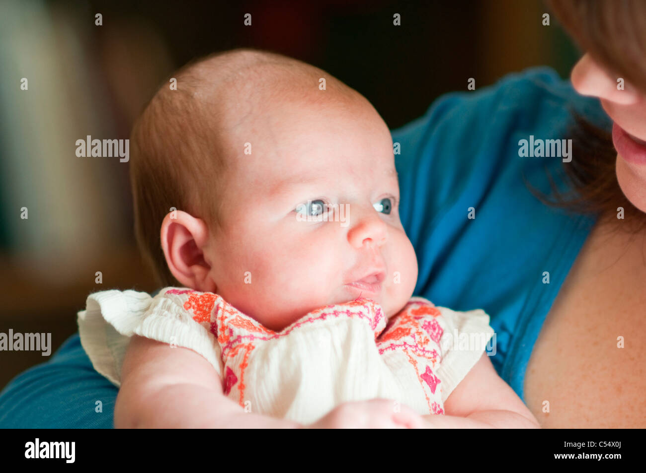 Mother holding baby close hi-res stock photography and images - Alamy
