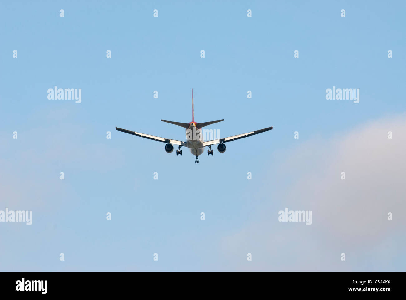 Single airplane on the blue sky background Stock Photo - Alamy
