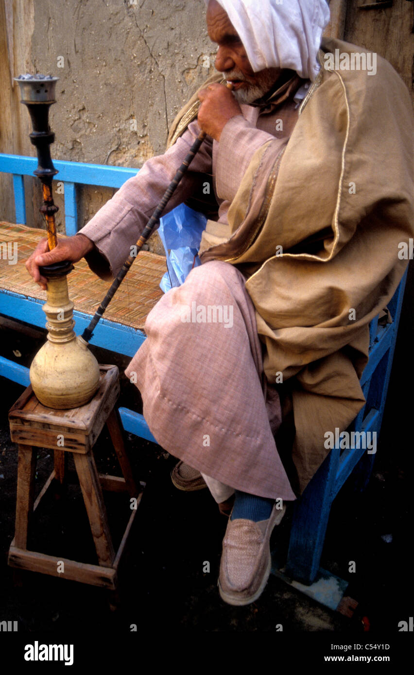 Old Arab smoking a traditional nargila pipe in Muharraq Bahrain, 1975 ...