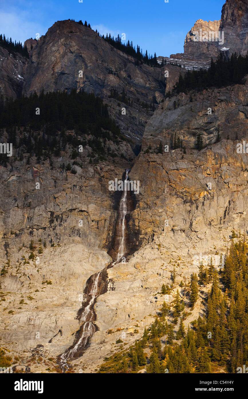 Waterfall cascading down mountain cliff, Cascade Falls, Bow Valley Parkway, Banff National Park ...