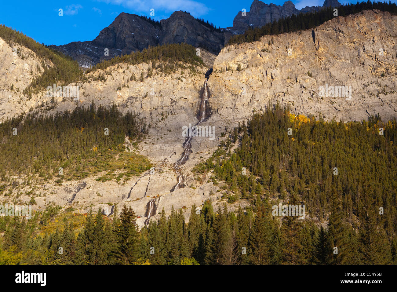 Waterfall cascading down mountain cliff, Cascade Falls, Bow Valley Parkway, Banff National Park ...