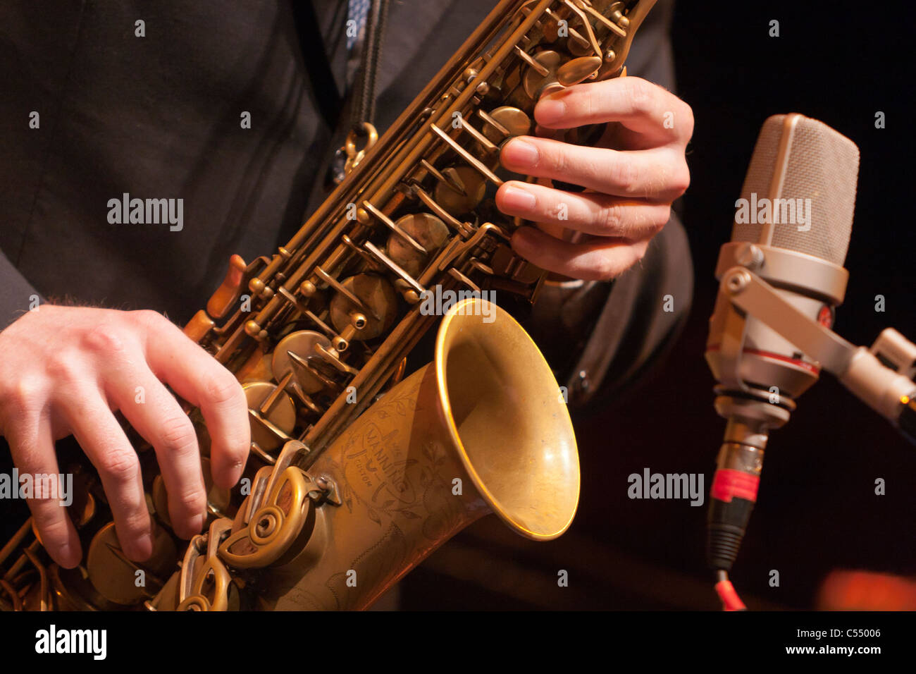 Musician playing a saxophone Stock Photo - Alamy