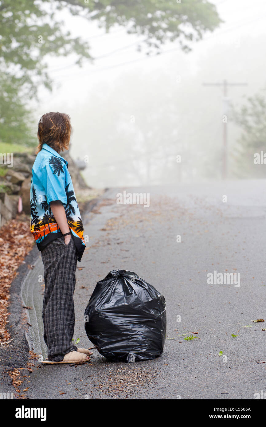 Teenage Girl waiting for garbage man Stock Photo - Alamy
