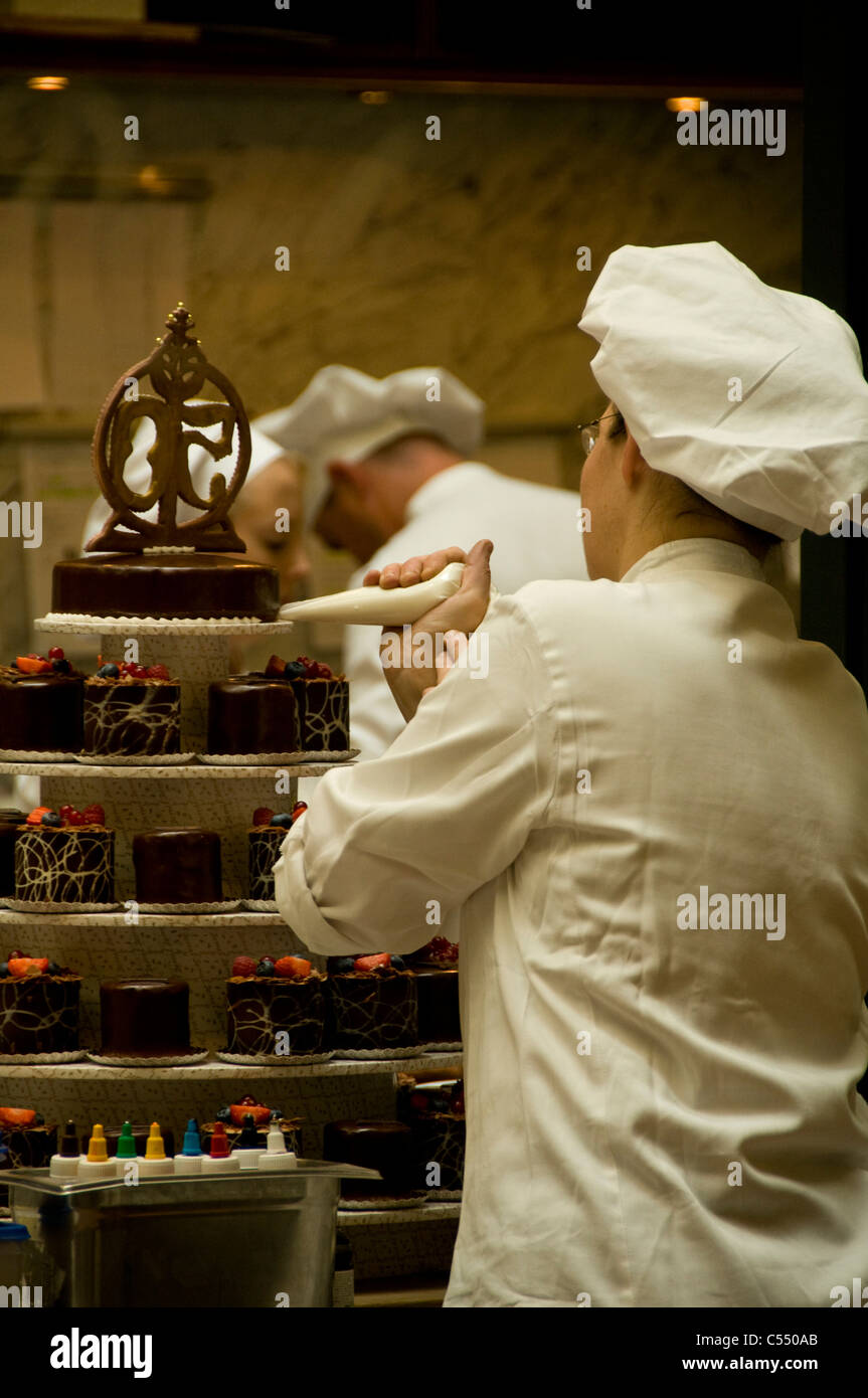 Chef icing a cake in the kitchen, Vienna, Austria Stock Photo - Alamy