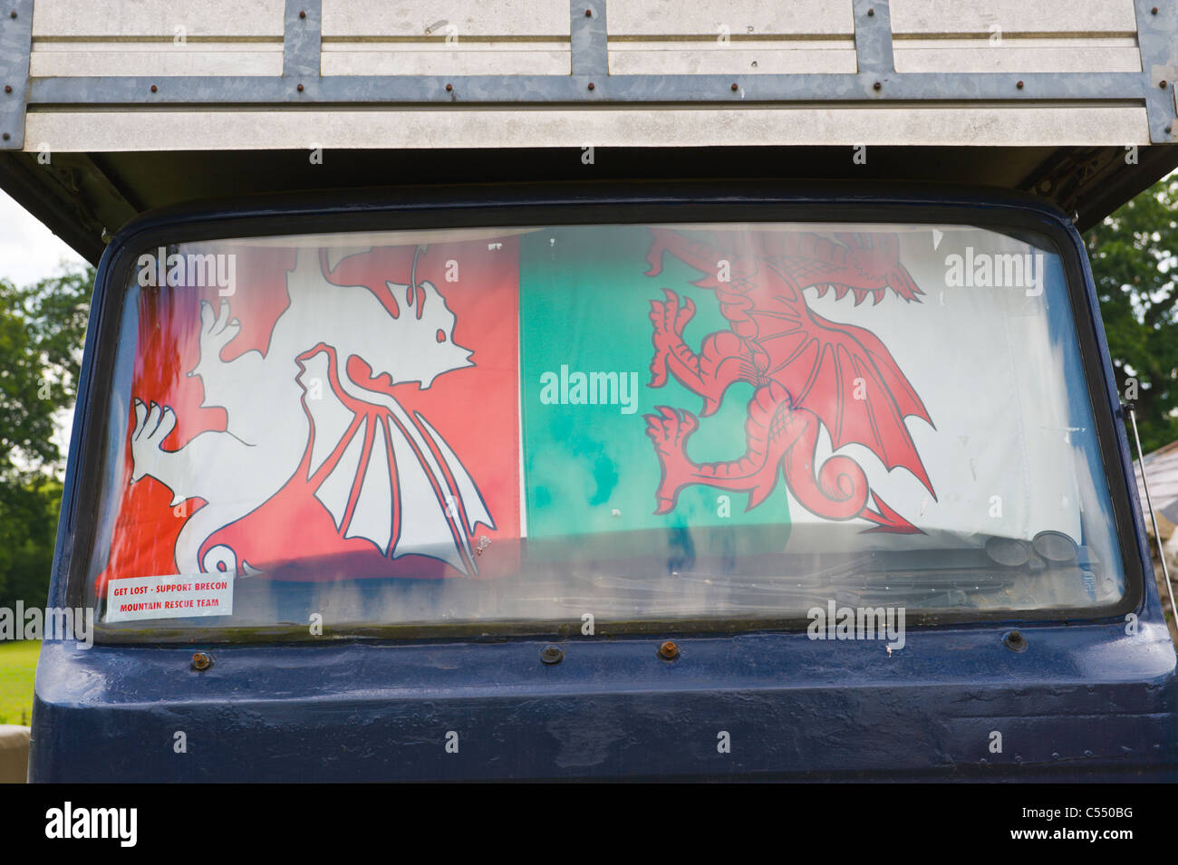 Red dragon flags covering windscreen of lorry in Wales Stock Photo - Alamy