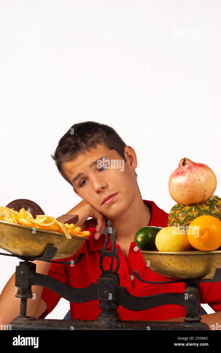 Teen missing his junk food after a fruit diet Stock Photo - Alamy