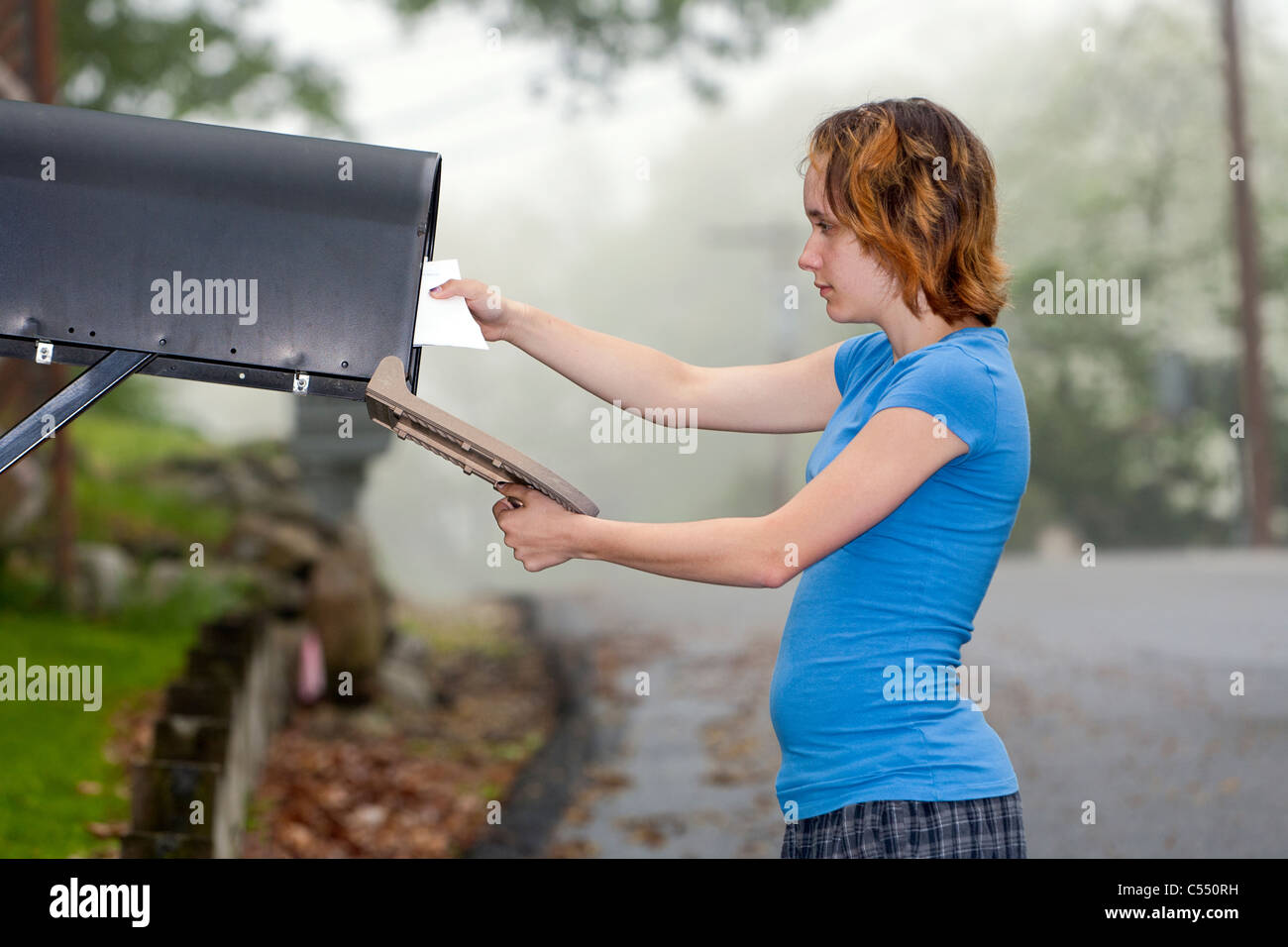 Teenage Girl getting the mail Stock Photo - Alamy