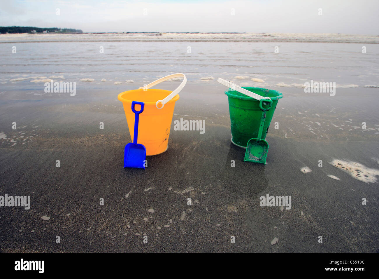 Sand Pails and Shovels on the beach Stock Photo - Alamy