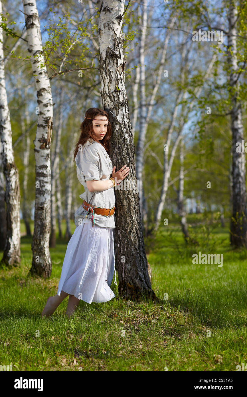 outdoor portrait of beautiful hippie girl posing in birch forest Stock ...