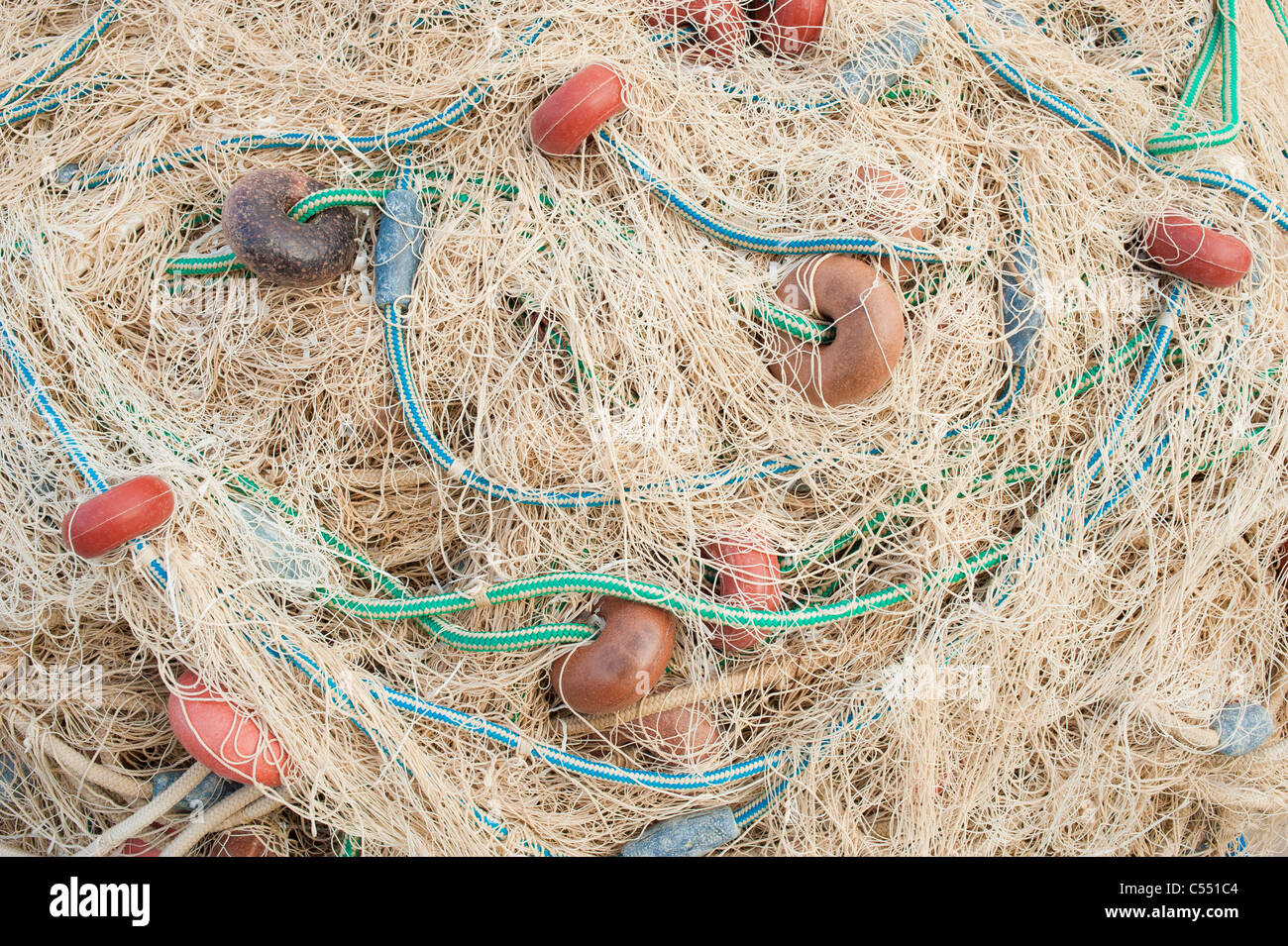 Colorful fishing nets piled up, a background Stock Photo - Alamy