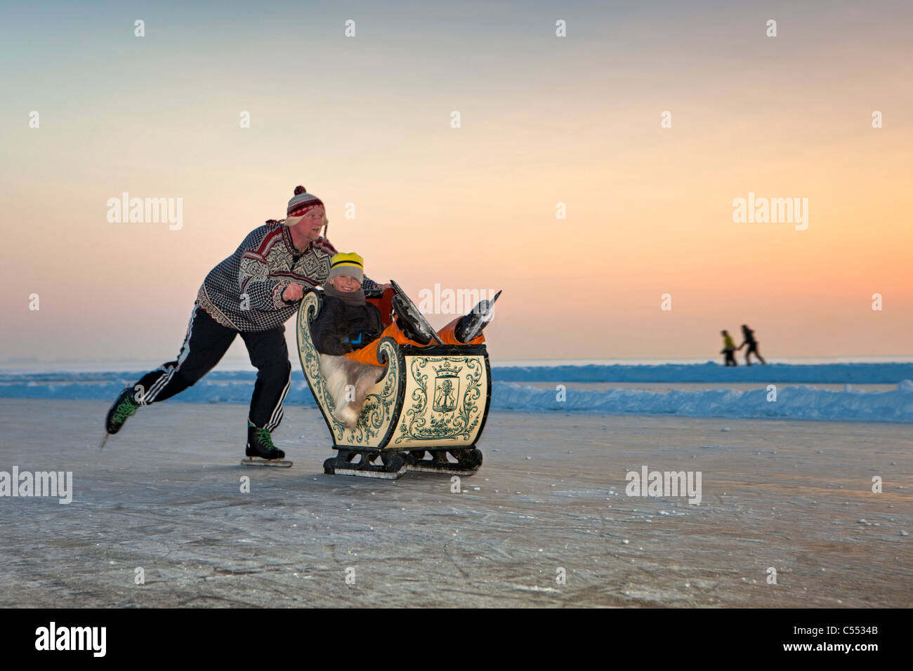The Netherlands, Hindeloopen, the Dutch capital of skating culture. Man ...