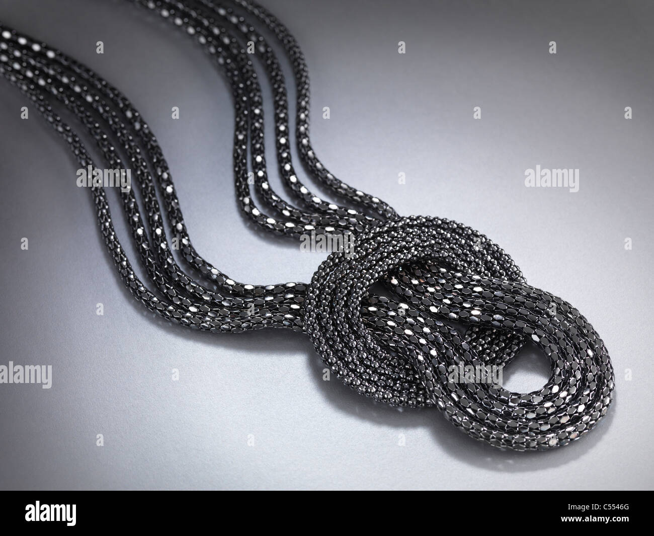 Necklace jewellery isolated on gray background Stock Photo - Alamy