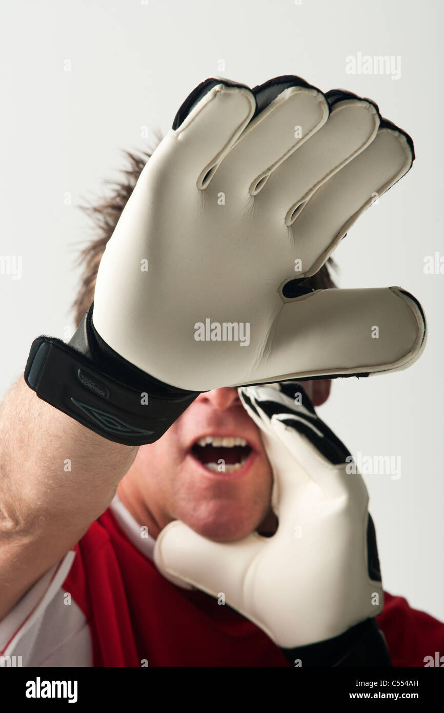 Goal keeper shouting Stock Photo - Alamy