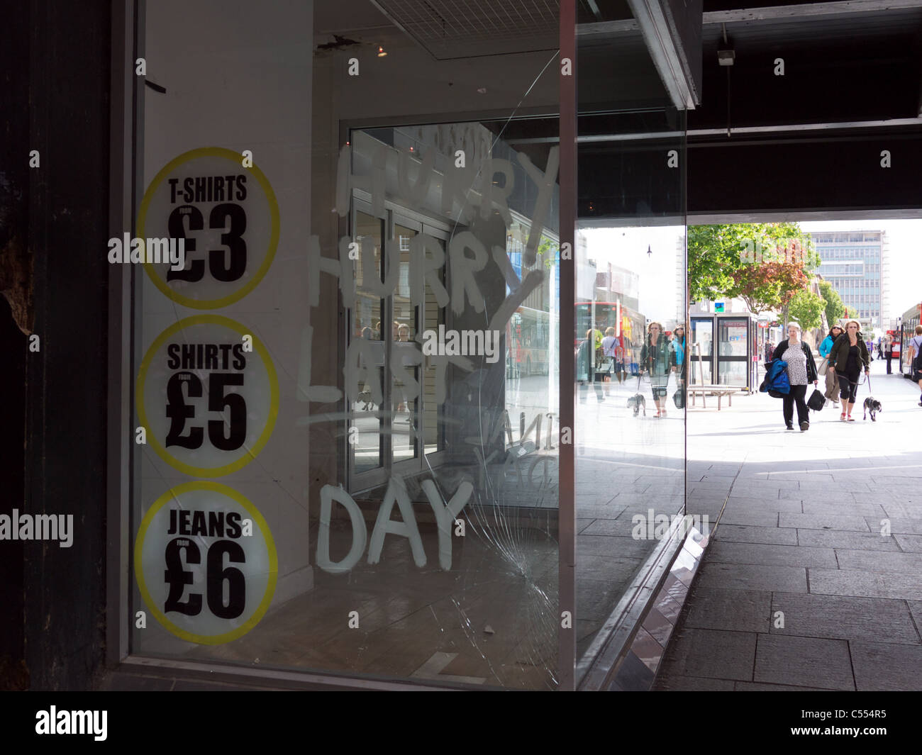 Exeter high street, closed shop with broken window Stock Photo - Alamy