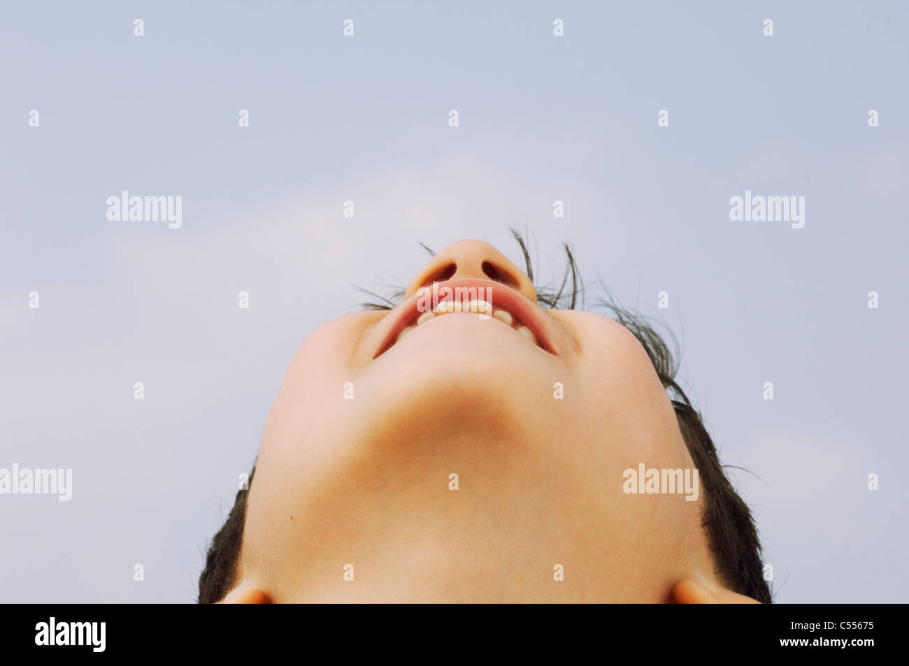 Little boy raising his head outdoors Stock Photo - Alamy