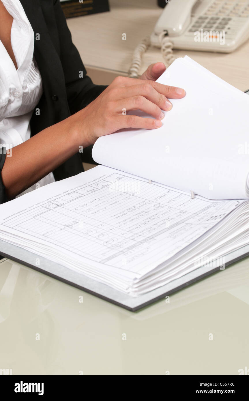 Woman working in office alone books hi-res stock photography and images ...