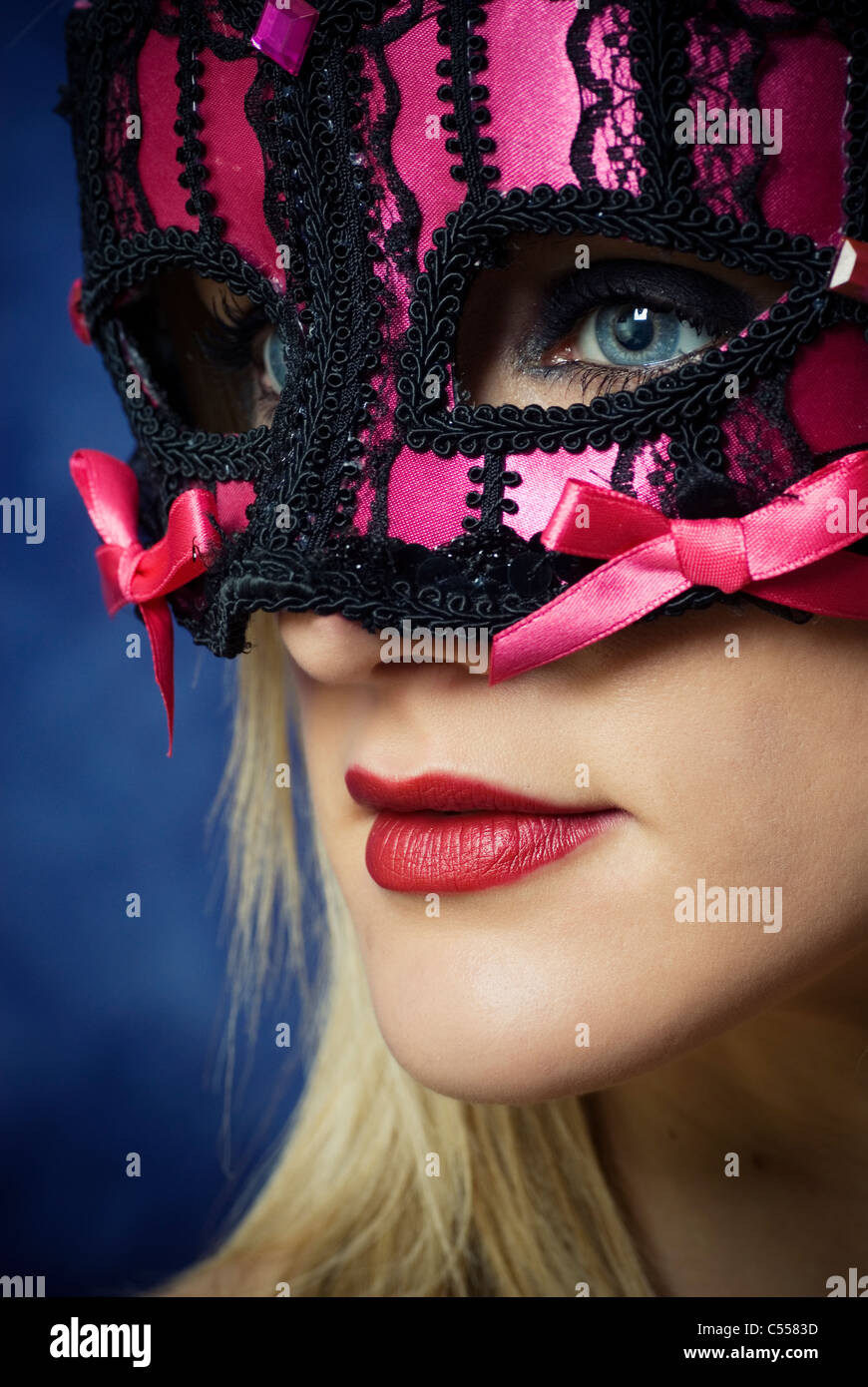 Mysterious woman in mask Stock Photo - Alamy