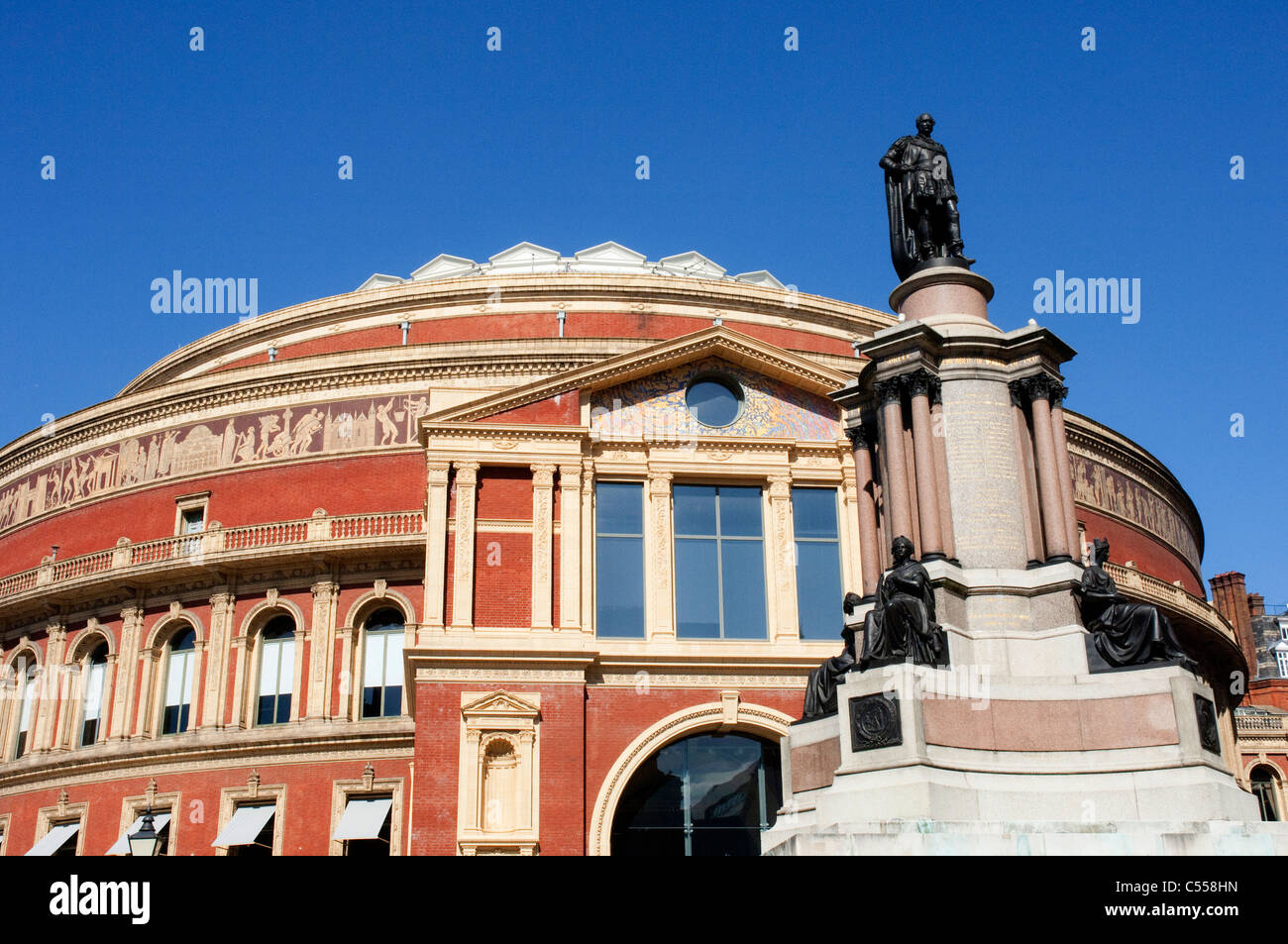 Statue in front of a monument, Royal Albert Hall, Kensington, London ...