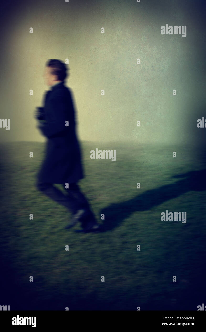 Blurred profile of a man running away Stock Photo - Alamy