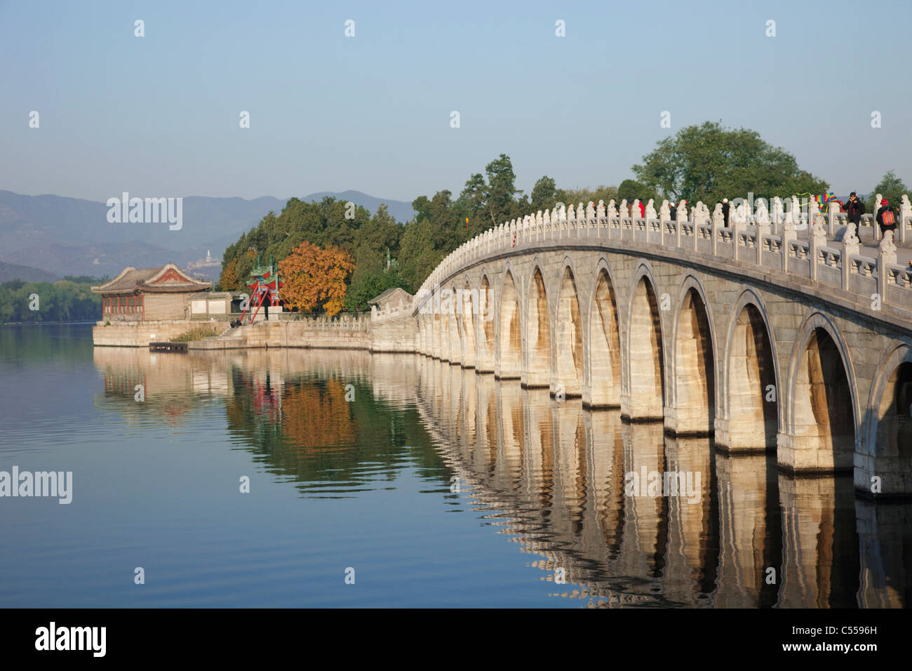 Arch bridge across a lake, Seventeen-Arch Bridge, Kunming Lake, Summer ...