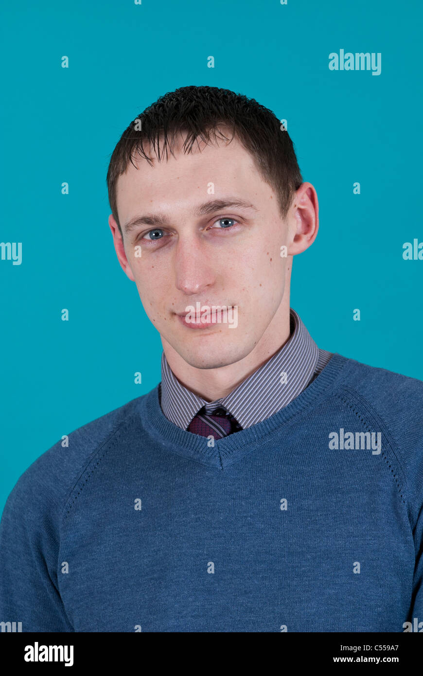 Young smart man smiling Stock Photo - Alamy