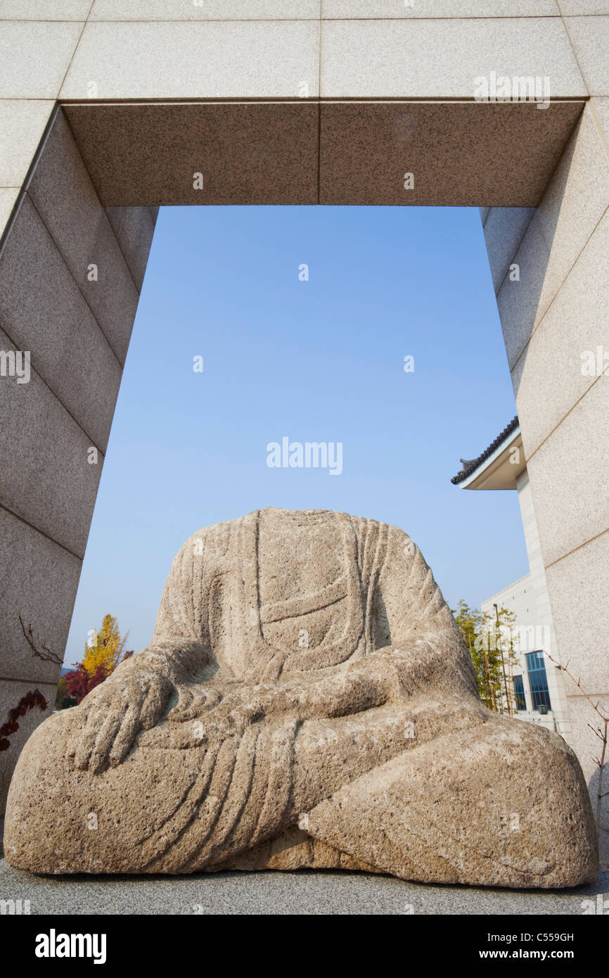 Headless stone statue of Buddha in a museum, Gyeongju National Museum ...