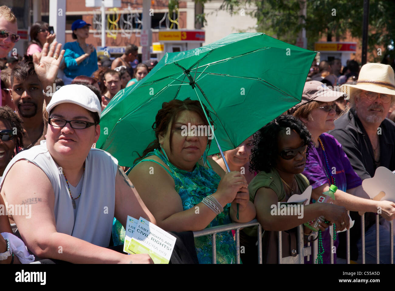 Spectators at the Chicago Pride Parade, 2011. Woman with dour look on ...