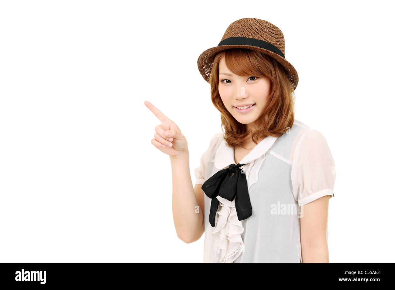 Portrait of young asian woman pointing Stock Photo - Alamy