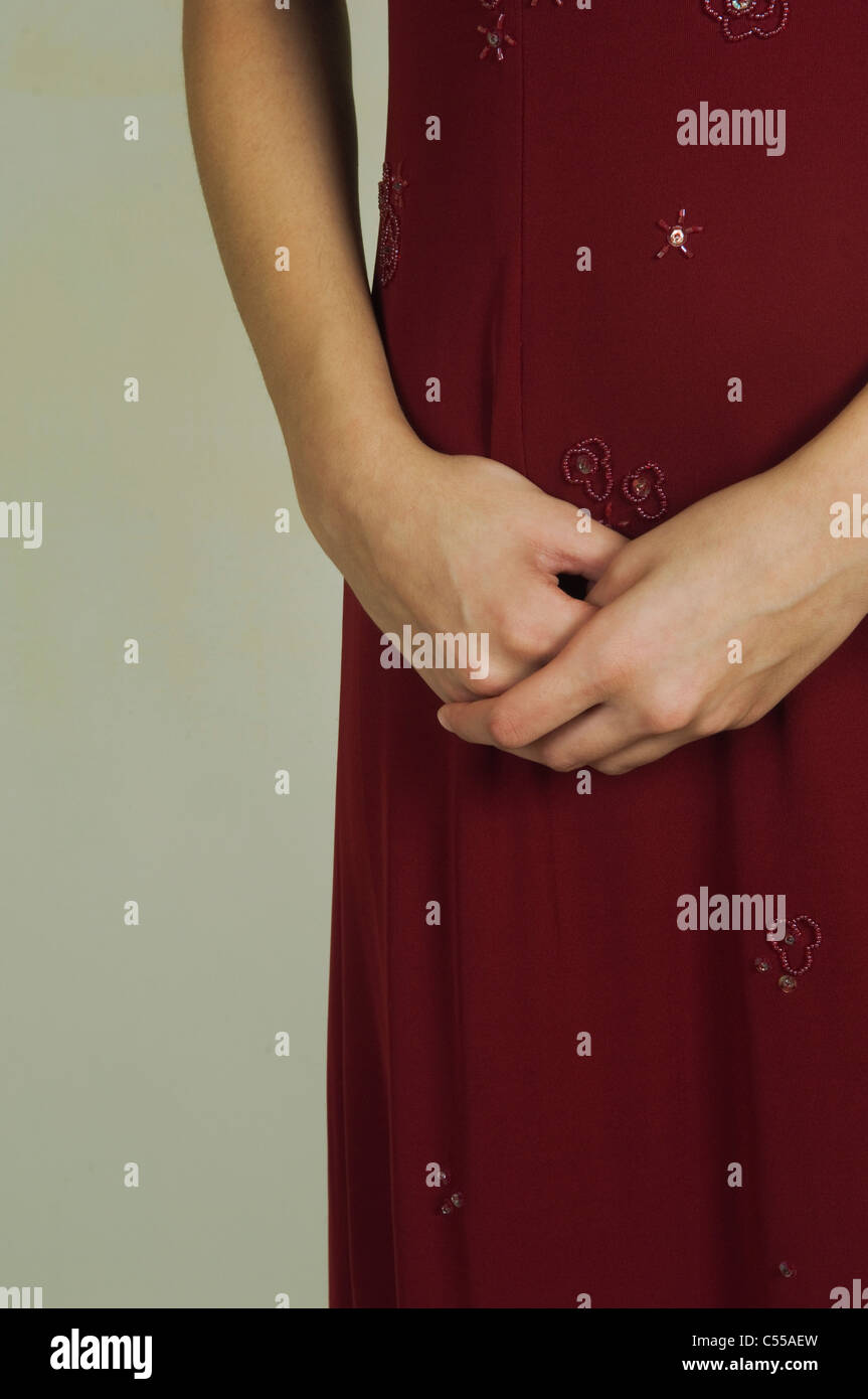 Woman in red dress waiting Stock Photo - Alamy