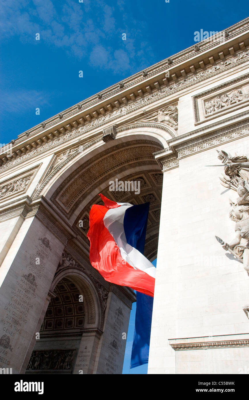 French flag beneath a triumphal arch, Arc De Triomphe, Paris, Ile-de ...