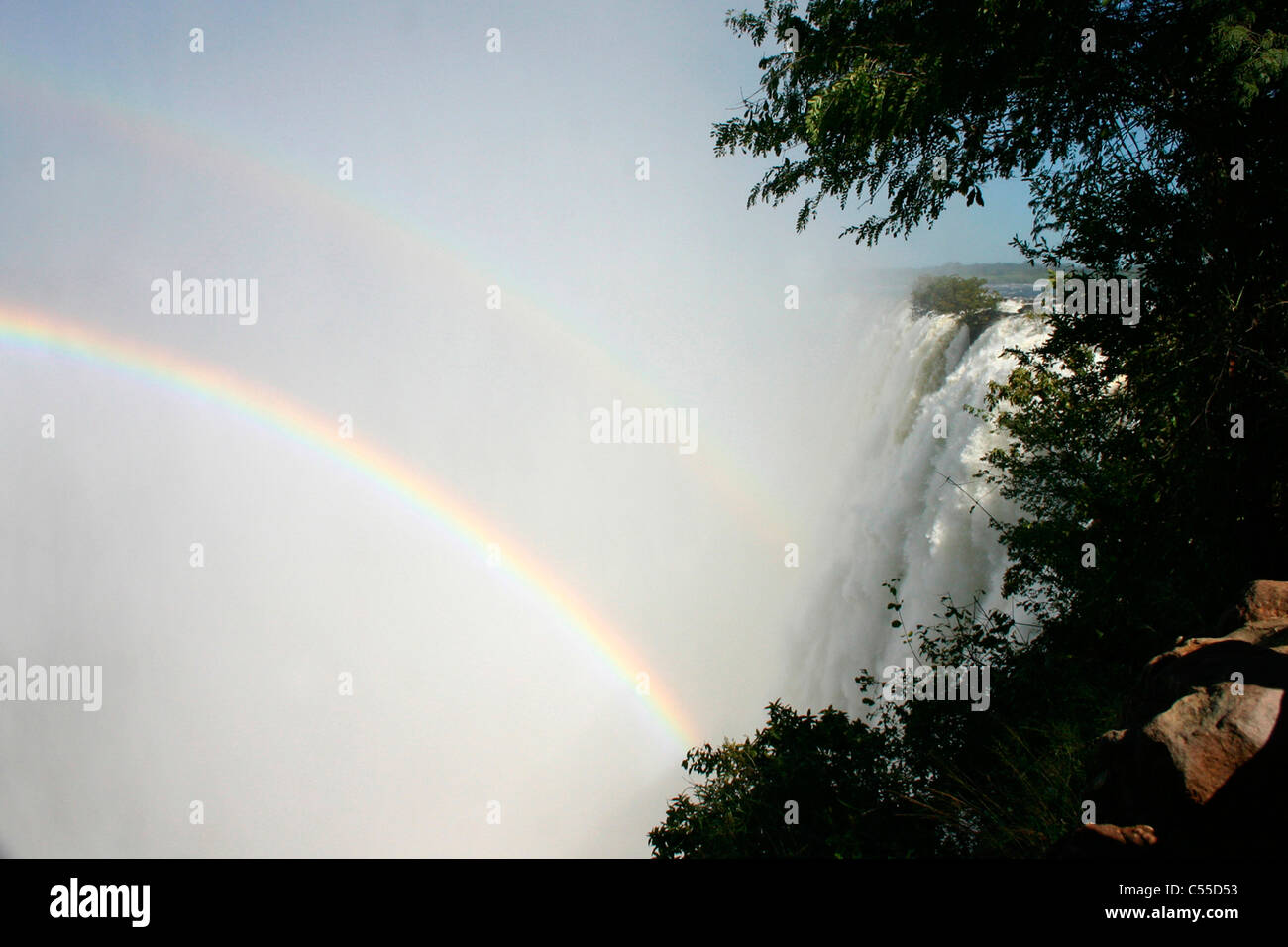 Rainbow over a waterfall, Victoria Falls, Zimbabwe Stock Photo - Alamy