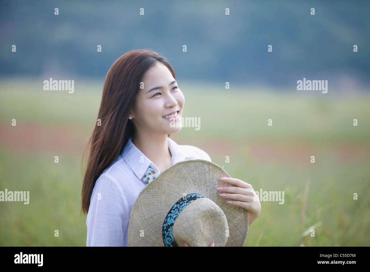 woman is smiling in the field Stock Photo - Alamy