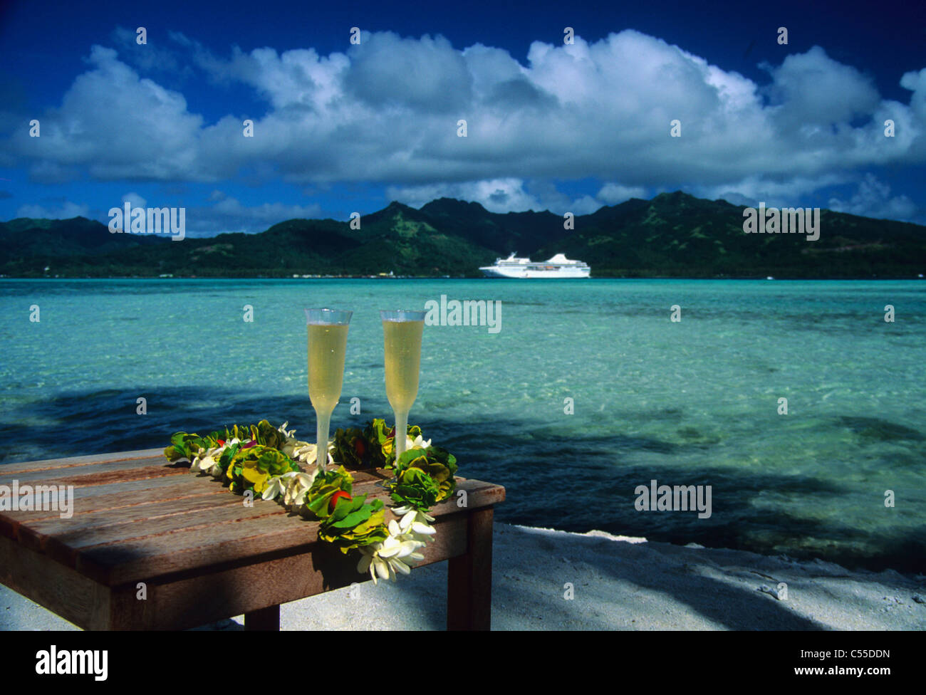French Polynesia, Tahiti, close up of decorated table with drinks by ...
