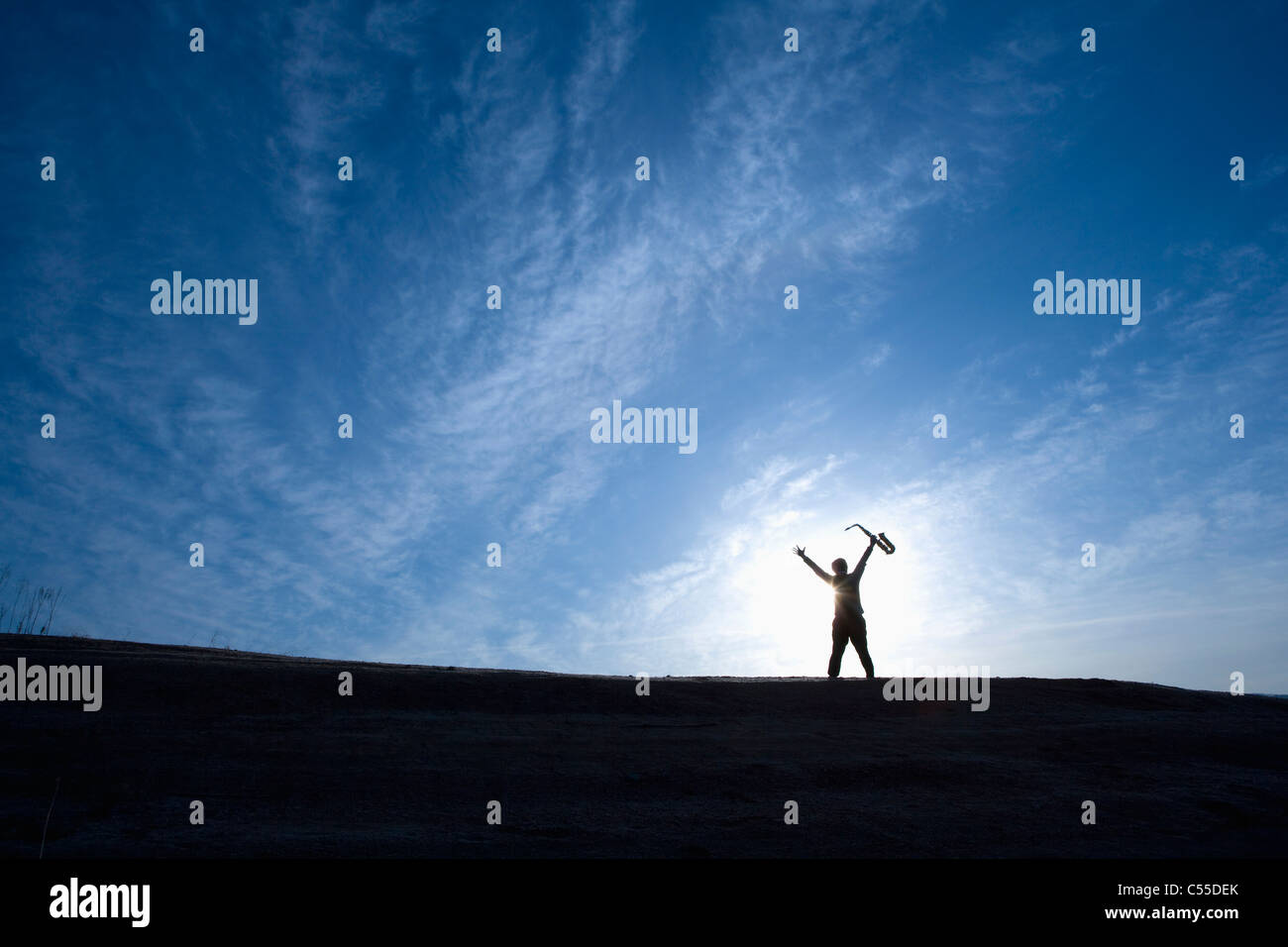 guy raised his hands with saxophone Stock Photo - Alamy guy raised his hands with saxophone Stock Photo - Alamy