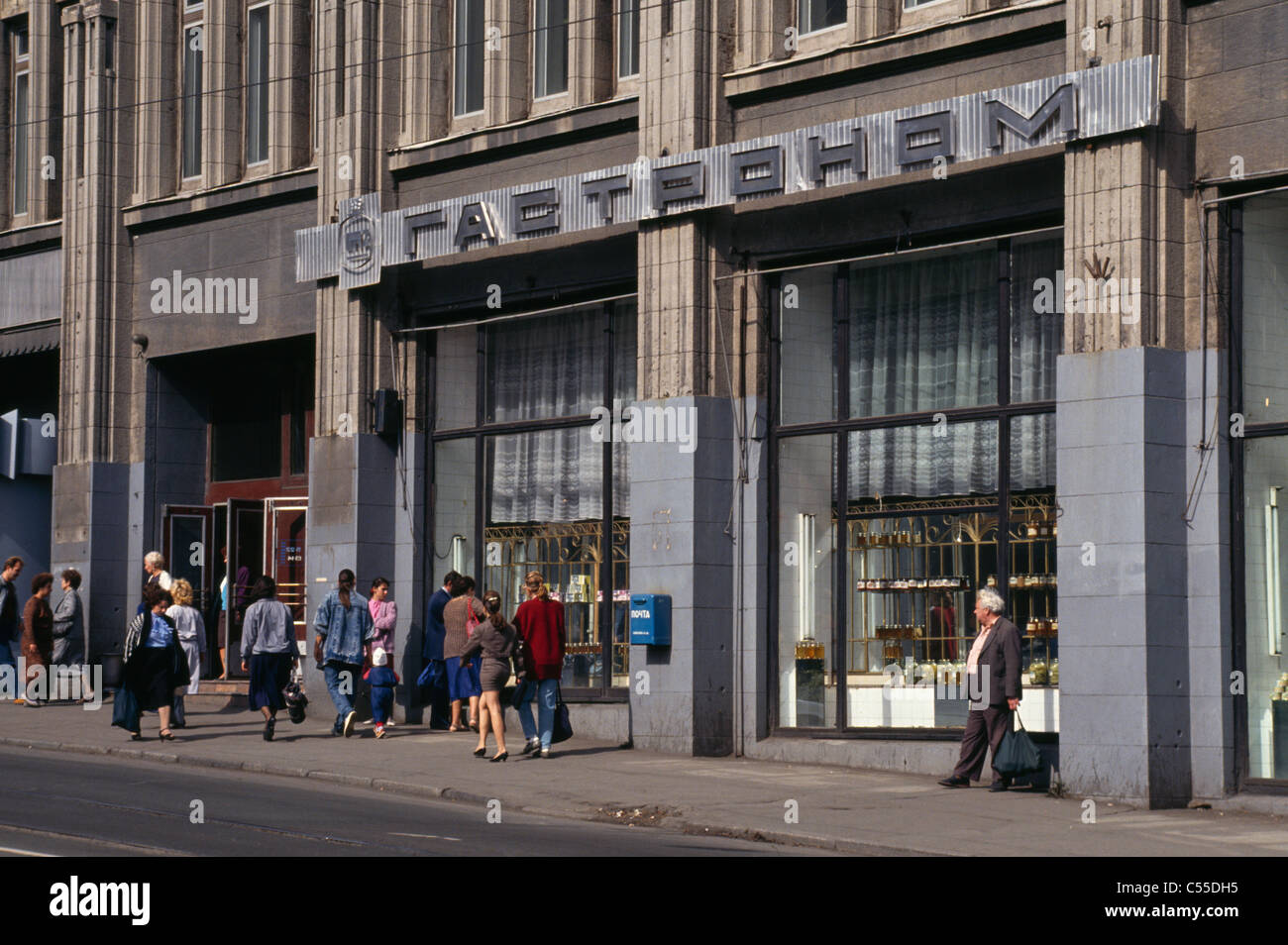Russia, Vladivostok, Pedestrian walking in front of shop Stock Photo ...